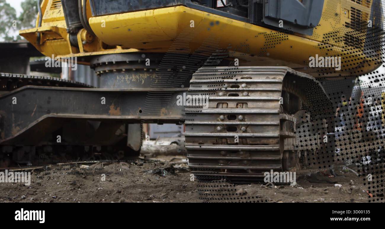 Crawling yellow excavator track moving through muddy debris at ...