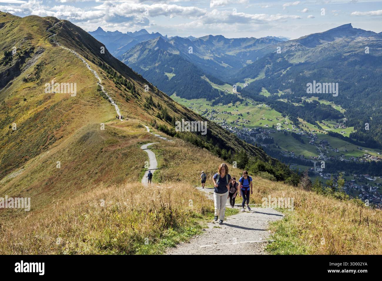 Hikers on the Fellhorn ridge hiking trail, behind Kleinwalsertal with ...