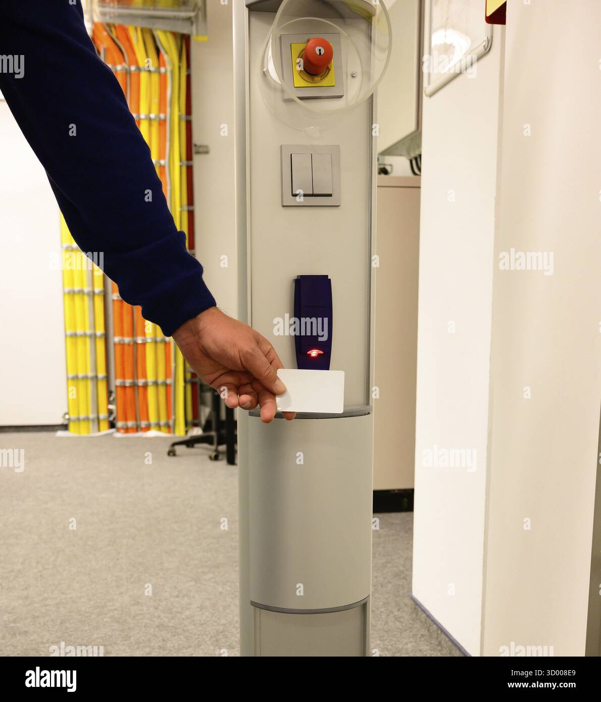 Hold the access card in front of an access system in a data center Hold ...
