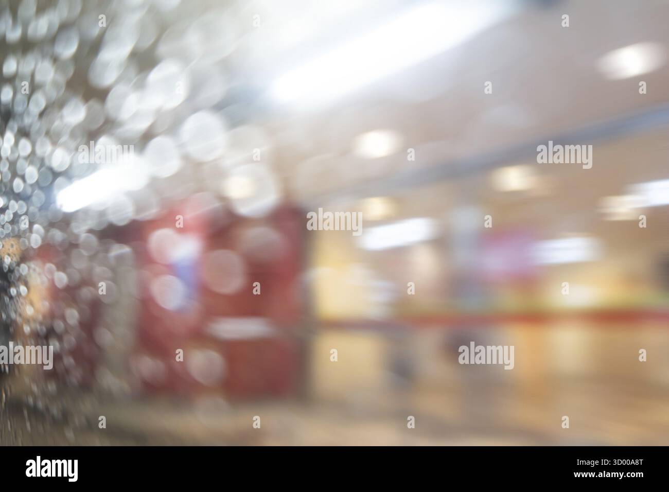 Blurred shopping mall underground basement entrance view in raining day ...