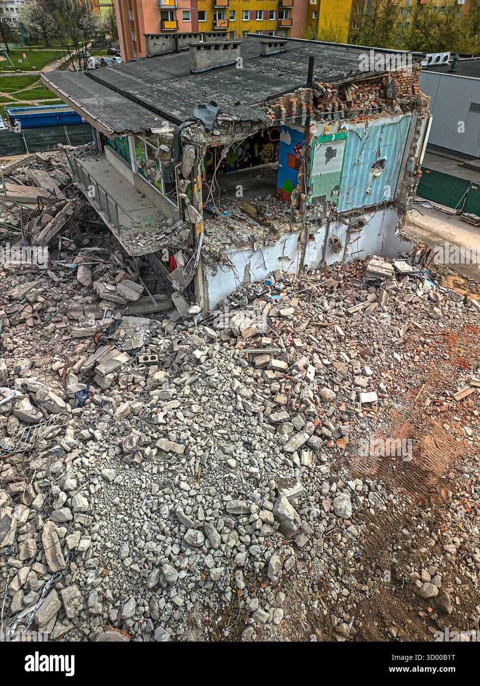 Aerial shot of excavators clearing rubble at the demolition site in ...