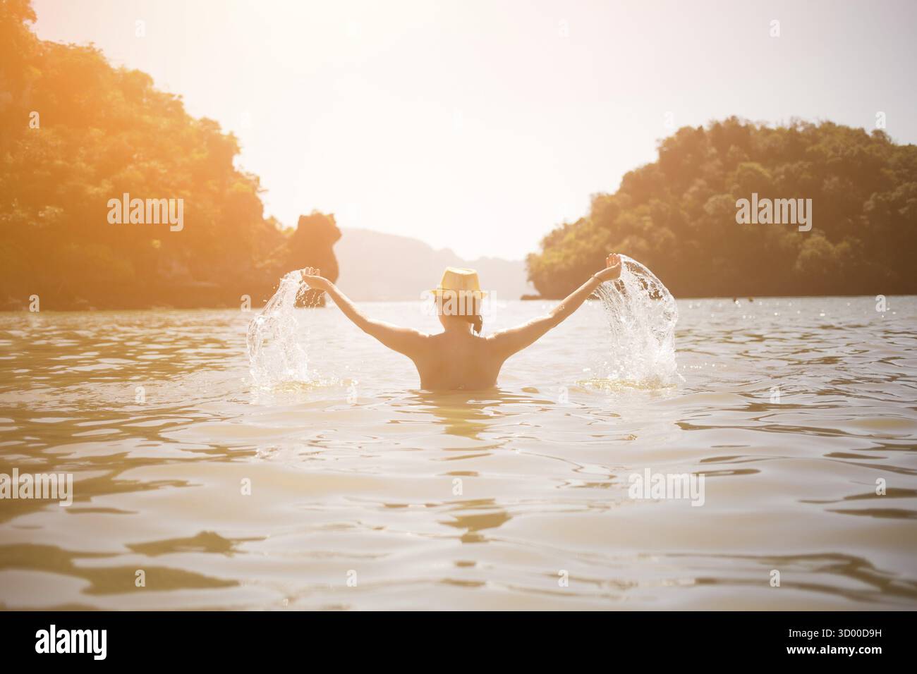 Woman raised arms stands hi-res stock photography and images - Alamy