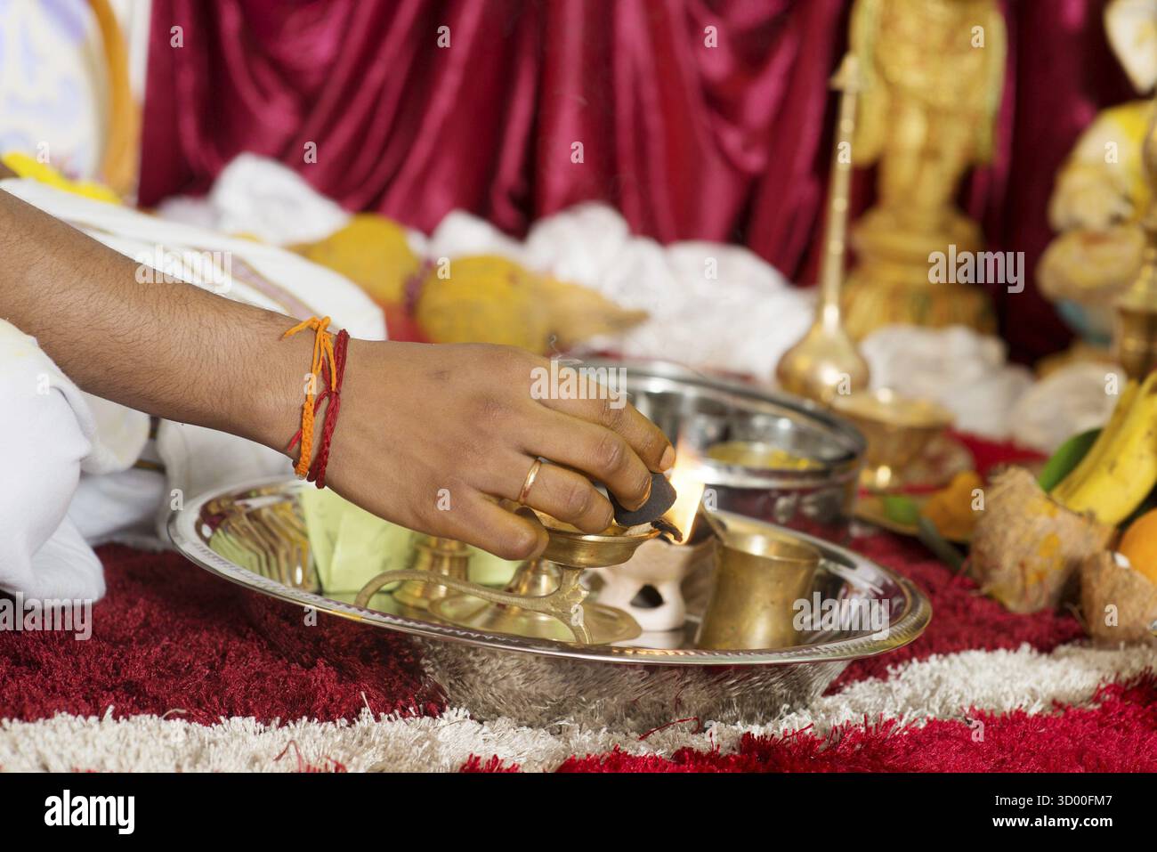 Traditional Indian Hindu religious praying items in ear piercing ...