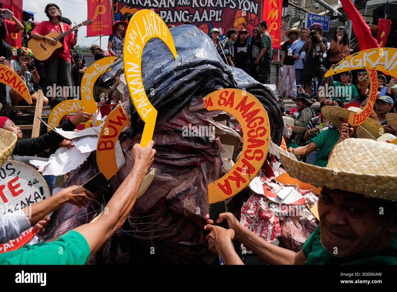 Protesters hit an effigy of Philippine President Ferdinand Marcos Jr ...