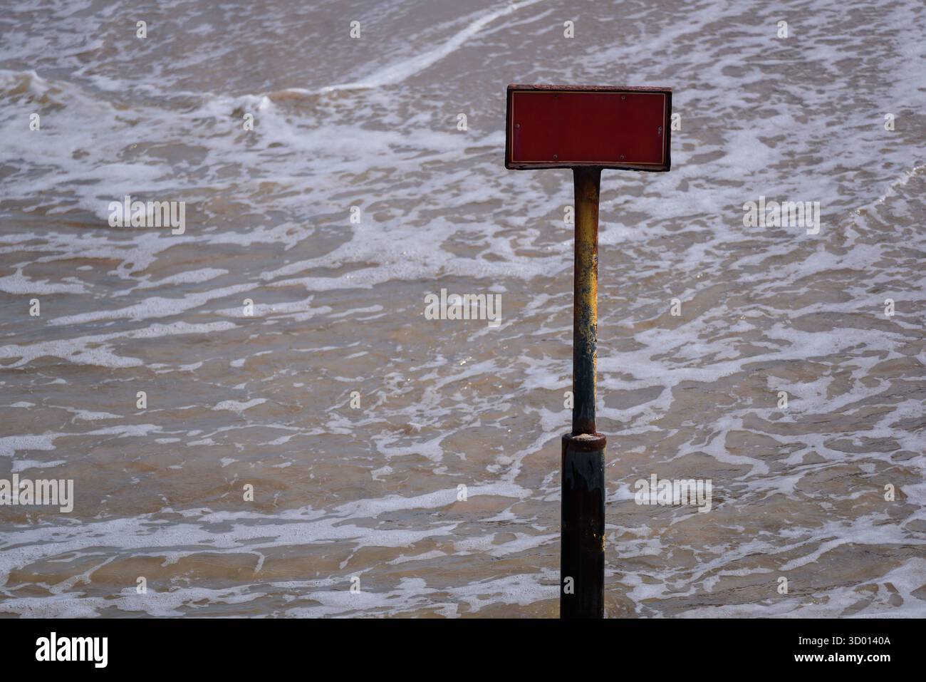 RED MARK AND WEATHER BY THE SEA Stock Photo - Alamy
