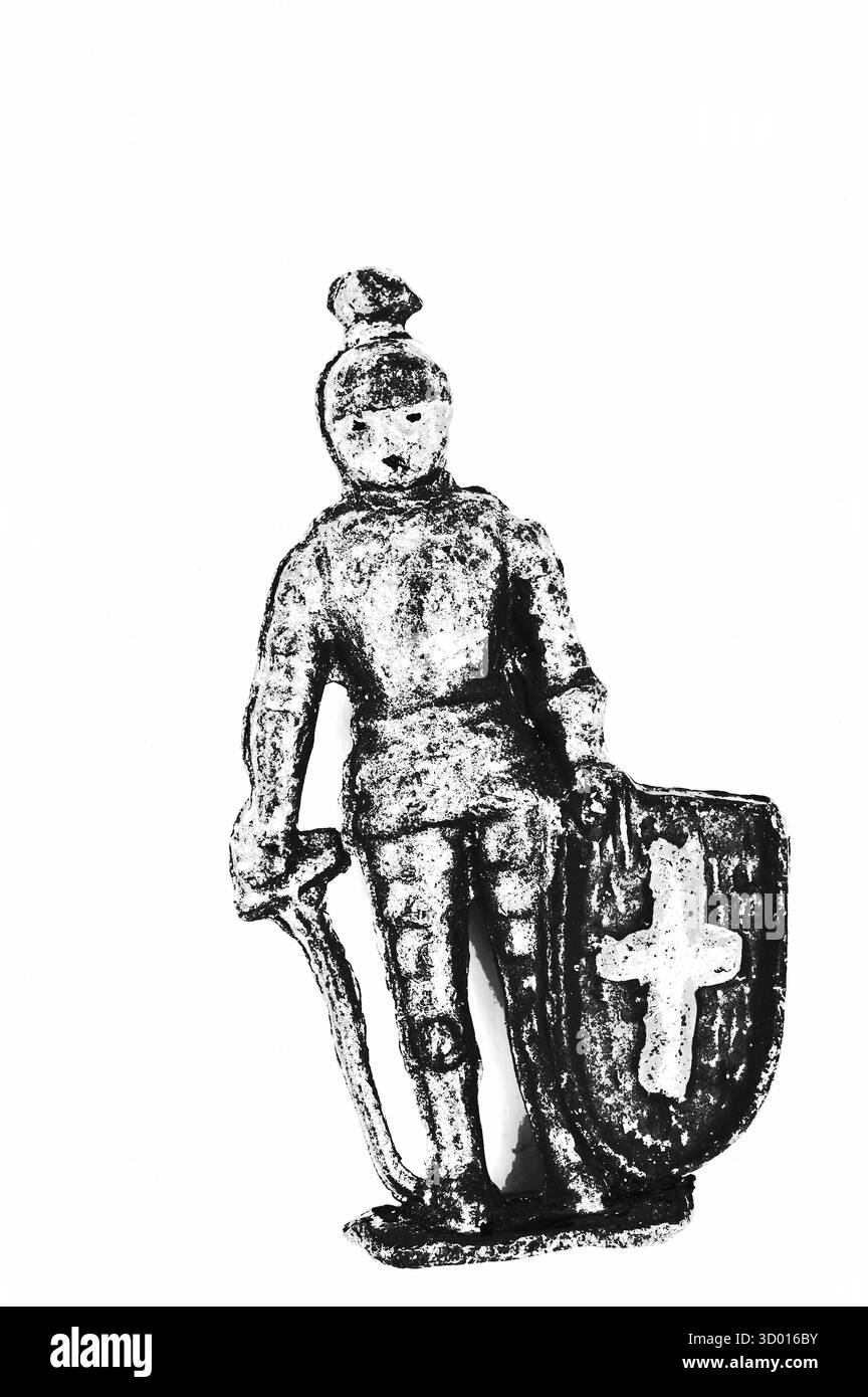 Graphic monochrome image of vintage lead model of Knight in armour ...