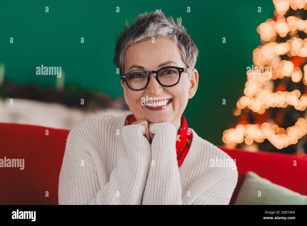Charming middle-aged woman in cozy indoor setting with festive ...