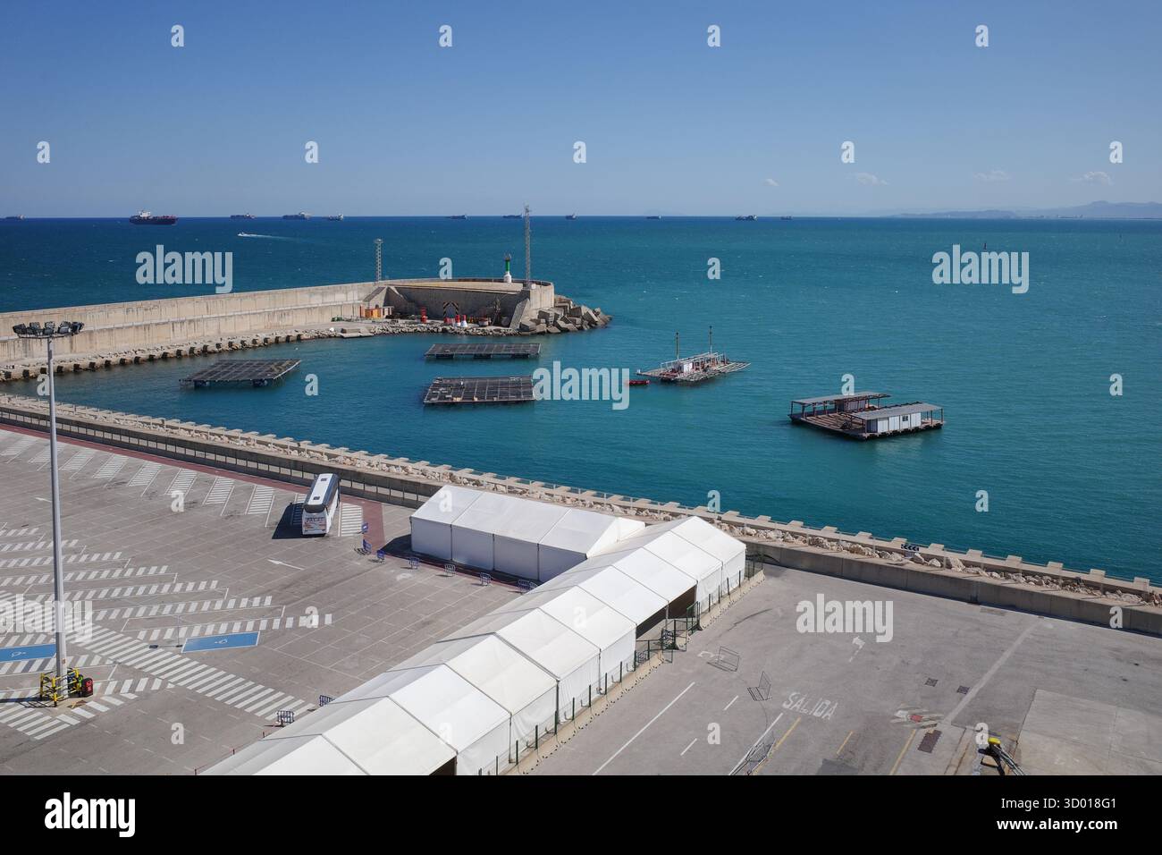 Aerial view of a harbor with aquaculture fish farms and floating ...