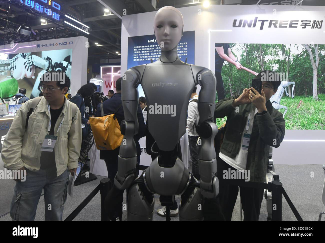 Viewers watch Unitree's first biomimetic humanoid robot H2 at a robot ...