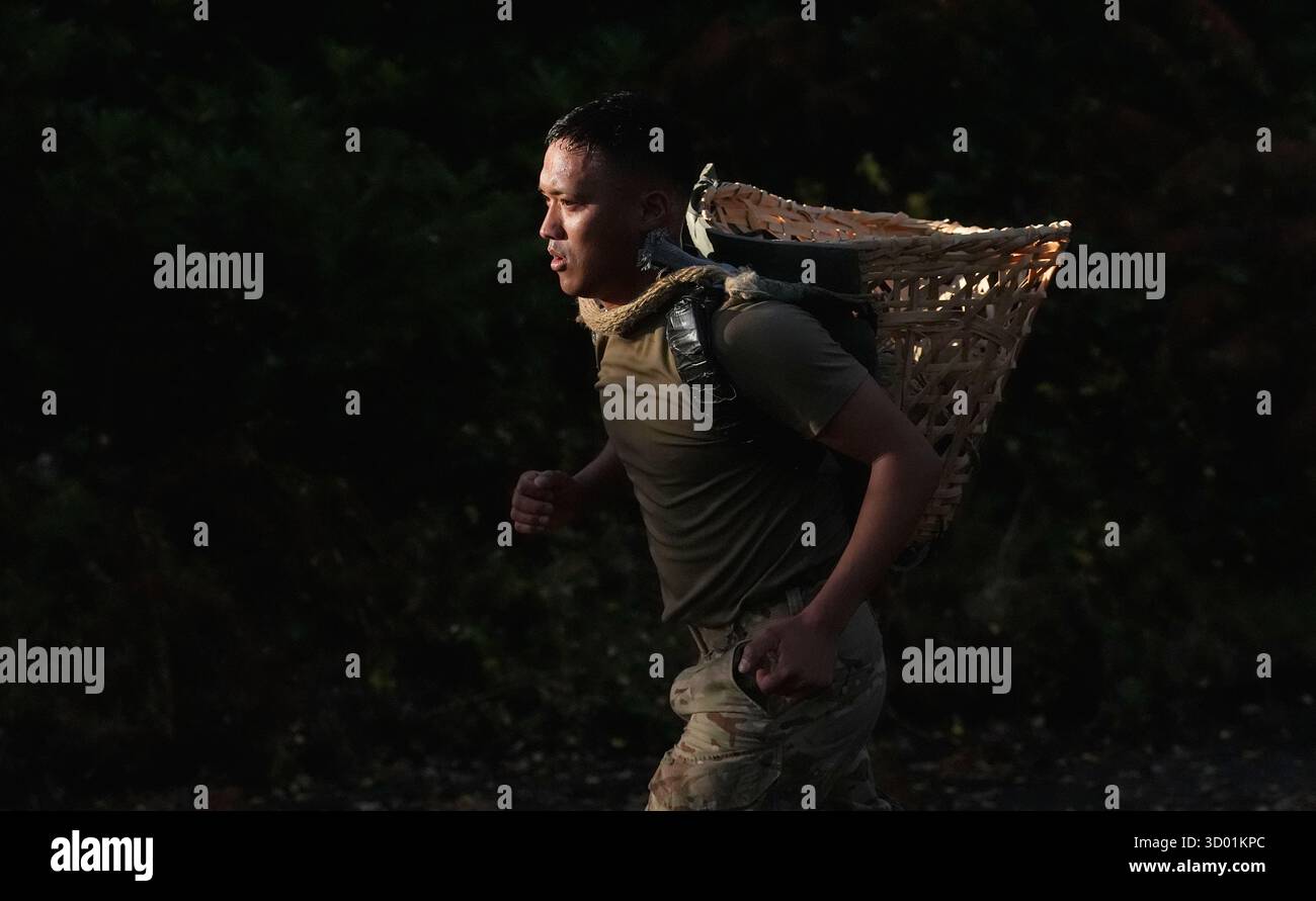 Members of the military take part in the tri-service Gurkha Doko race ...