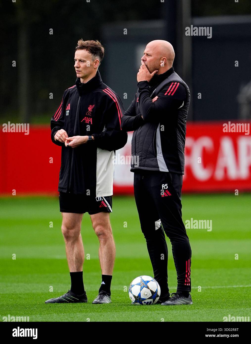 Liverpool manager Arne Slot (right) during a training session at the ...