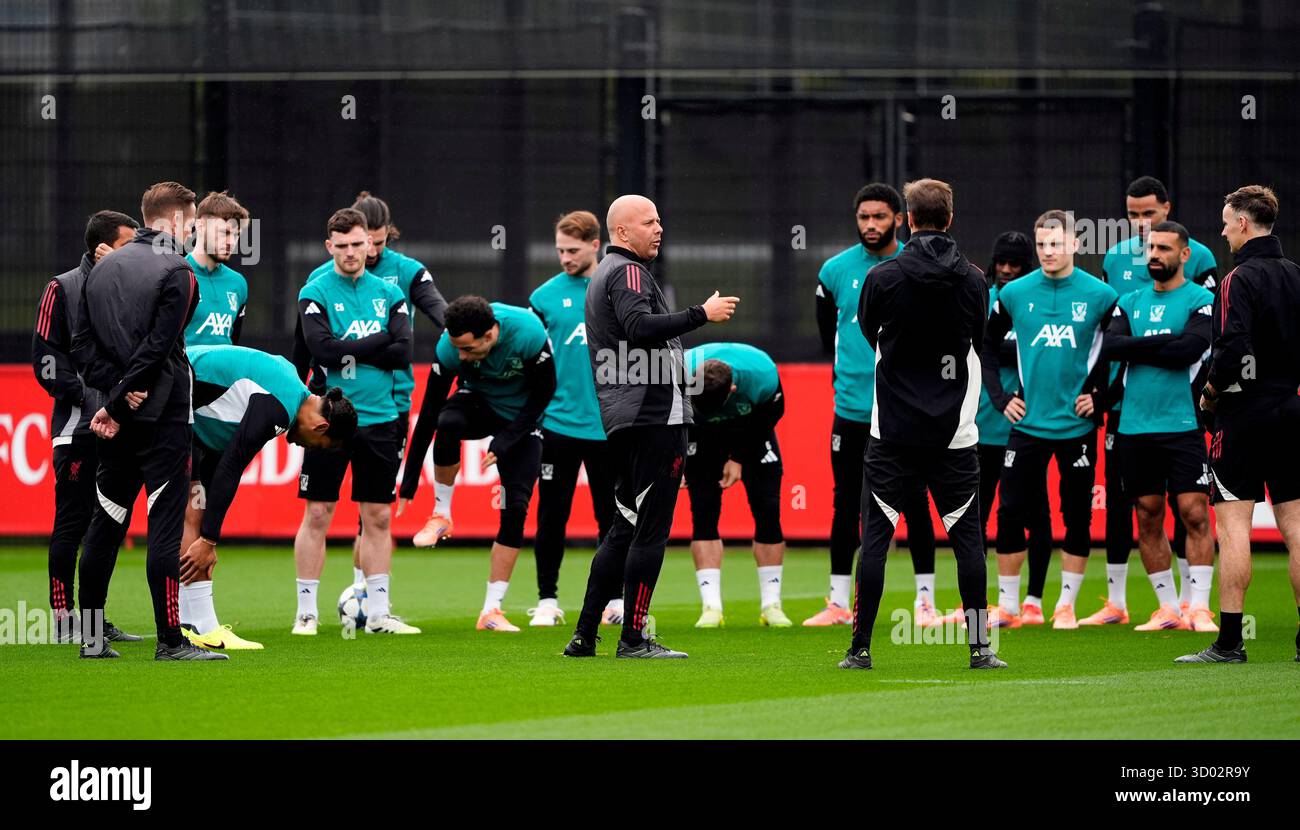 Liverpool manager Arne Slot with his players during a training session ...