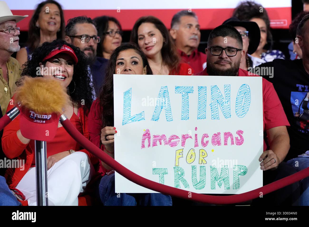 FILE - Supporters hold a sign before Republican presidential nominee ...