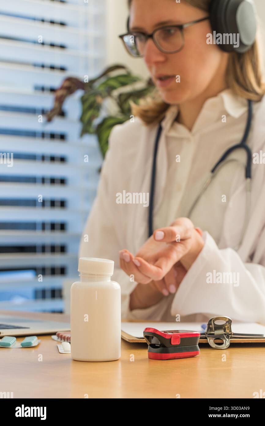Female doctor demonstrates how to measure pulse during online ...