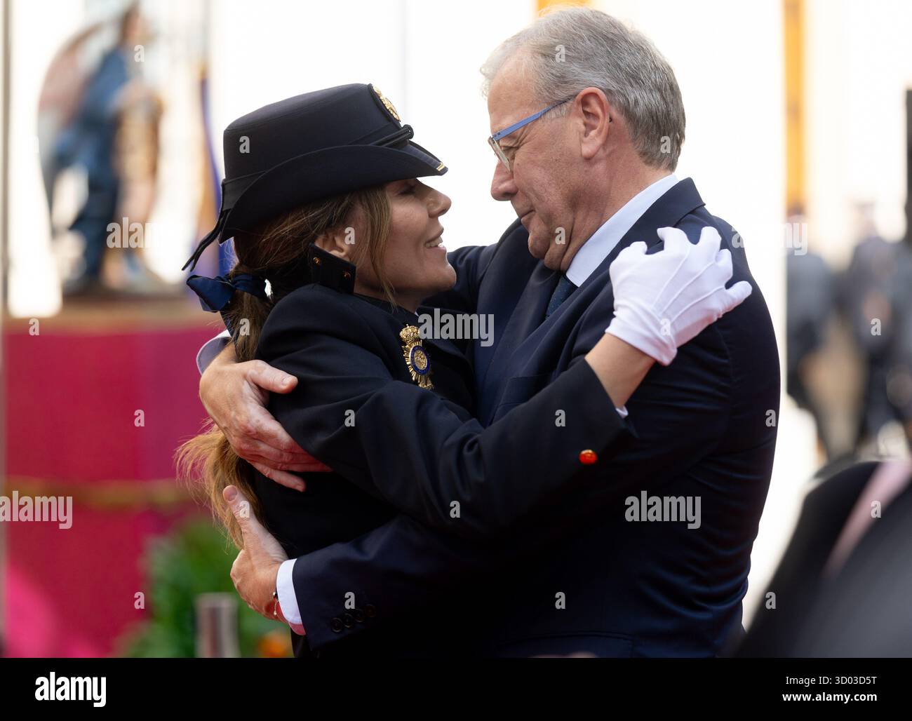 A member of the police force hugs another person during the police ...