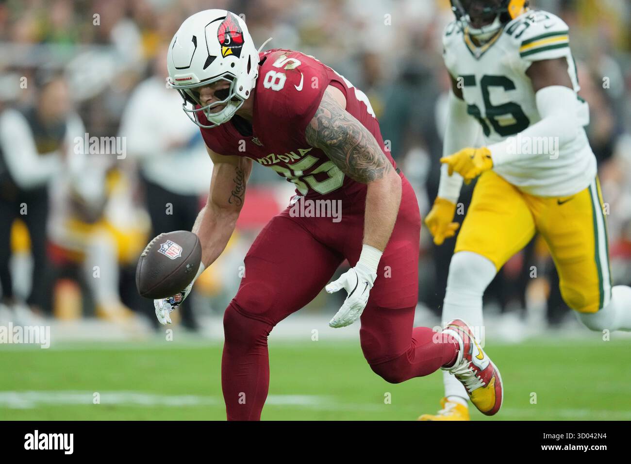Arizona Cardinals tight end Trey McBride chases down a loose ball ...