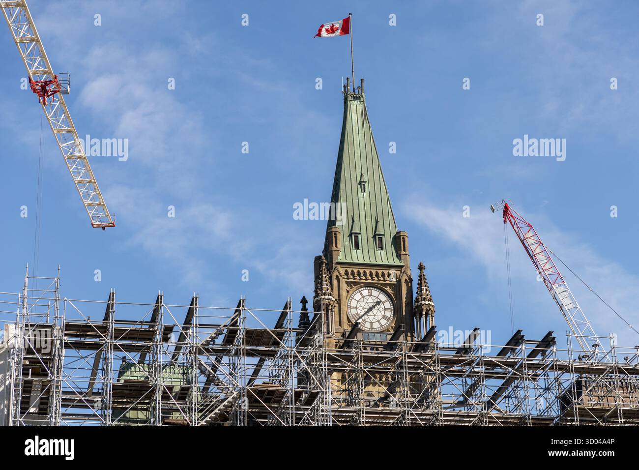 Parliament building Peace Tower with clock and Canadian flag under ...