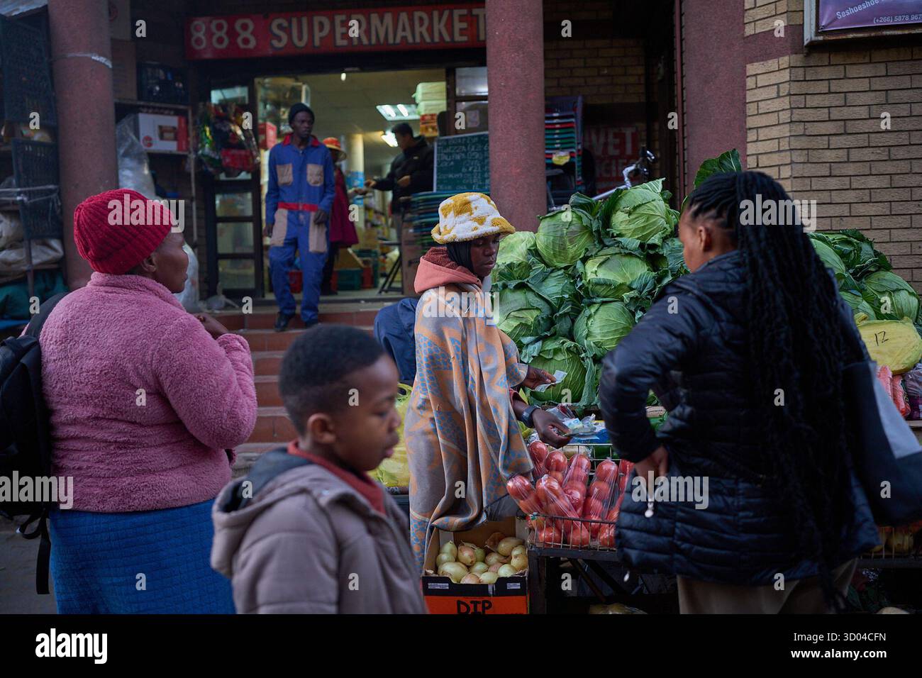 FILE - People buy vegetables at a market in Maseru, Lesotho, July 22 ...