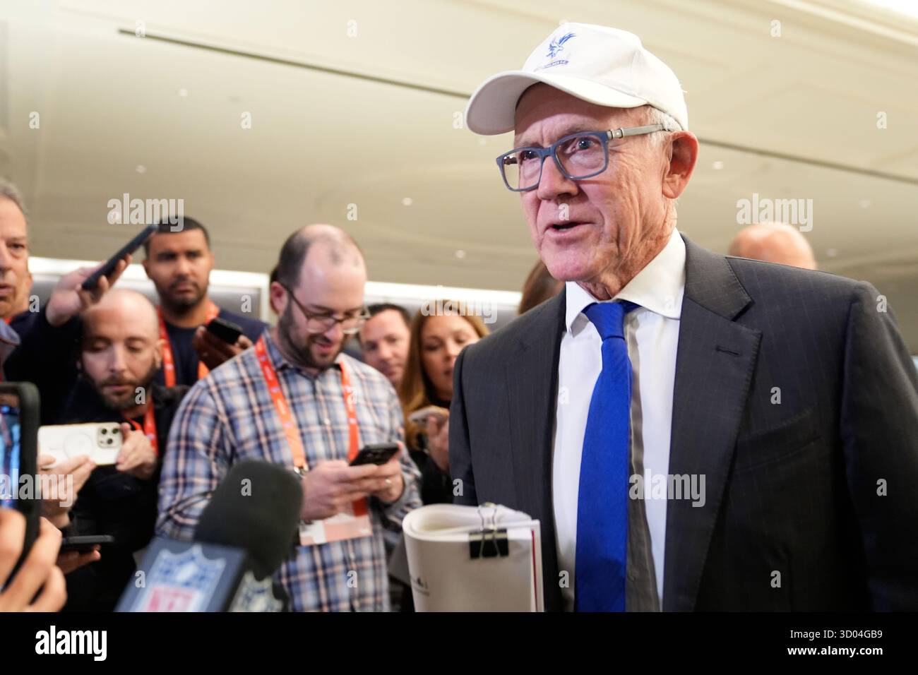 New York Jets owner Woody Johnson talks to reporters before attending ...