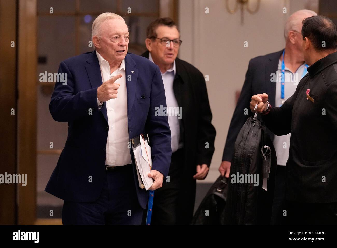 Dallas Cowboys owner Jerry Jones, left, arrives for NFL owners meetings ...
