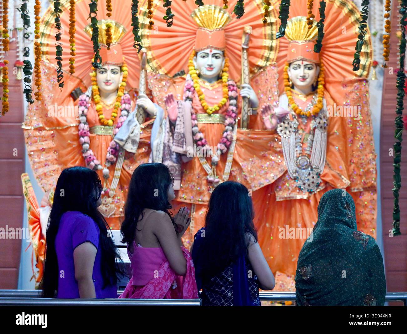 NOIDA, INDIA - OCTOBER 20: People offer prayers at a temple on the ...
