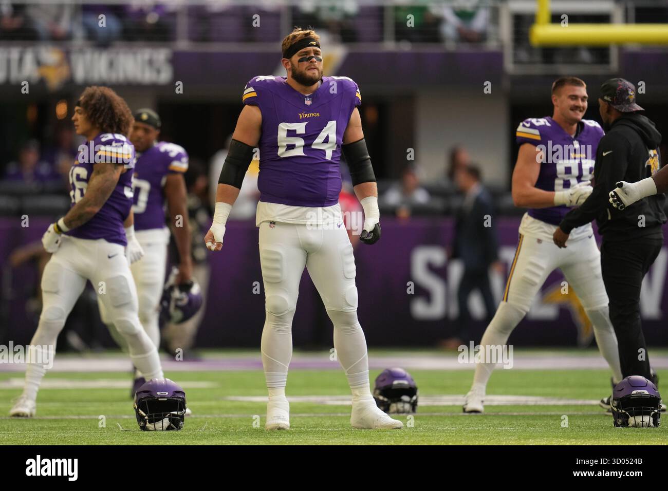 Minnesota Vikings guard Blake Brandel (64) stand on the field before an ...