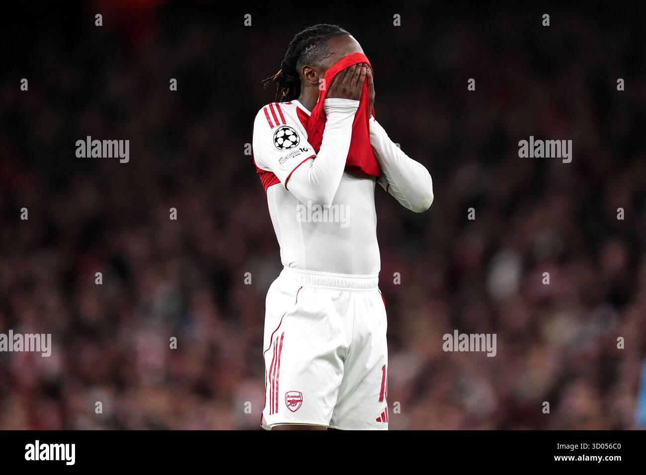 Arsenal's Eberechi Eze wipes his face during the UEFA Champions League ...