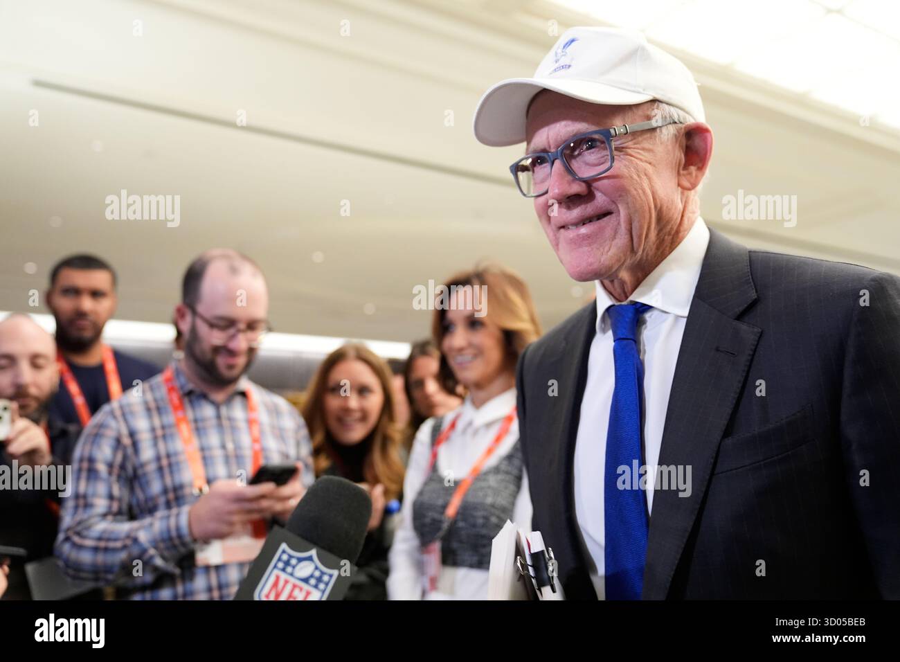 New York Jets owner Woody Johnson talks to reporters before attending ...