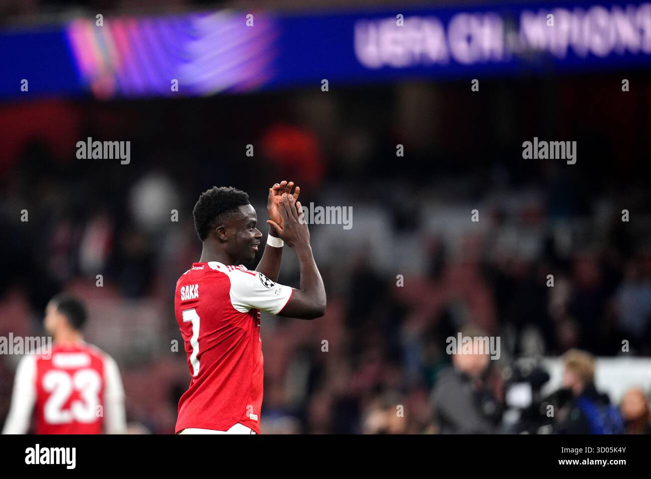 Arsenal's Bukayo Saka applauds the fans following the UEFA Champions ...