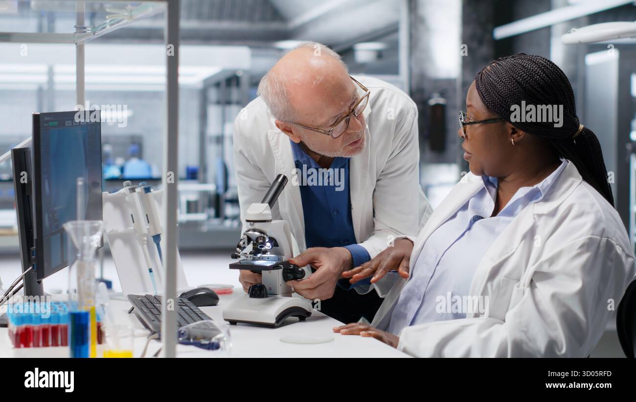 African american scientist focuses hi-res stock photography and images ...