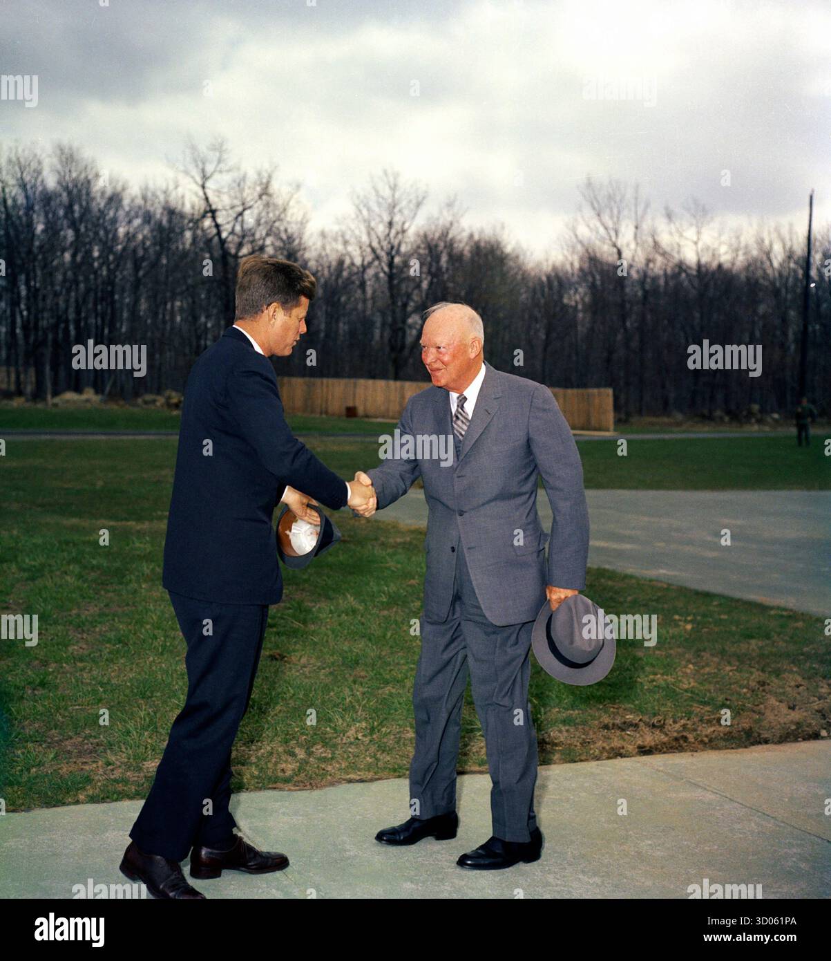U.S. President John F. Kennedy shaking hands with former U.S. President ...