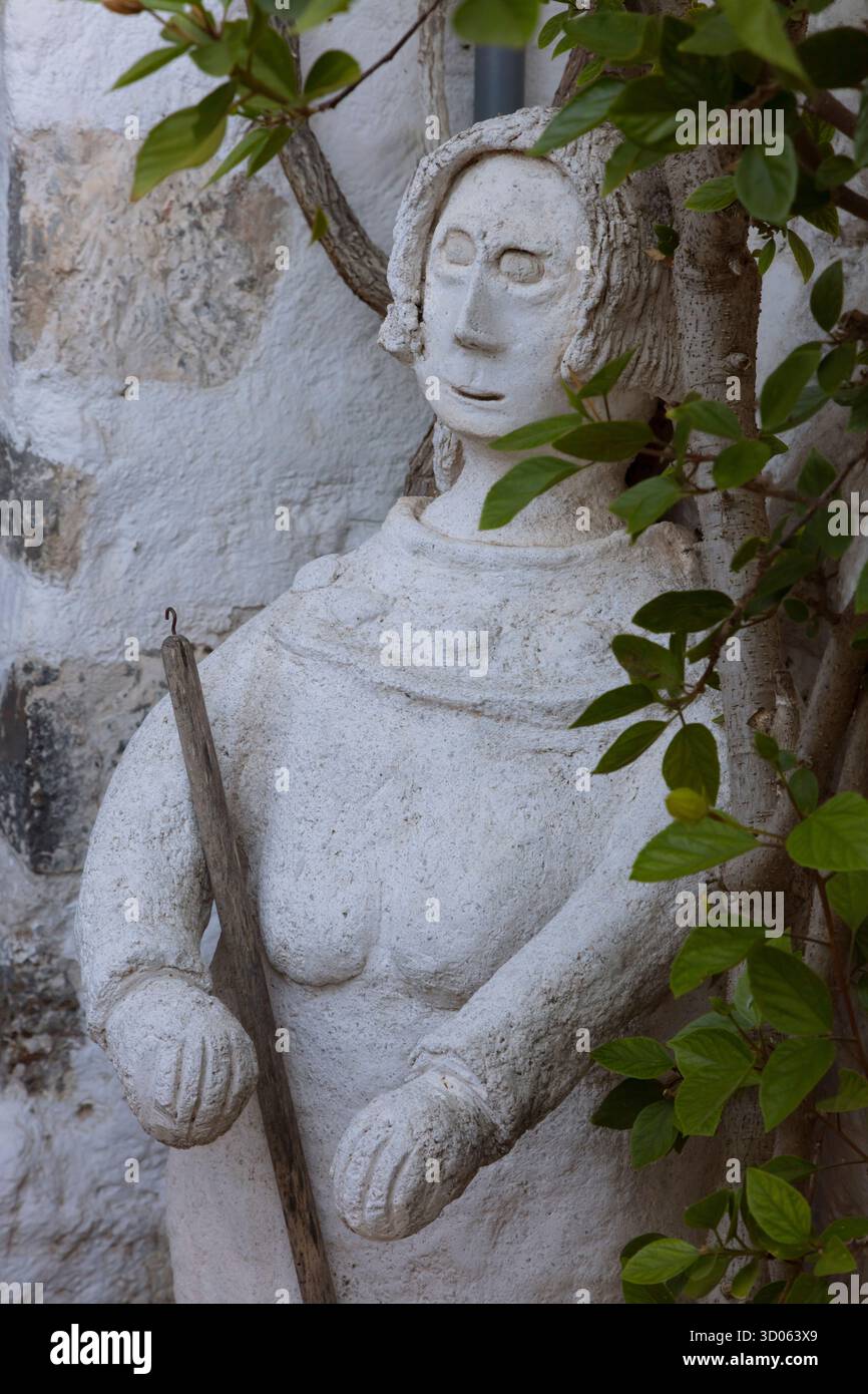 Sculpture of a woman in Kritsa one of the oldest and most picturesque ...