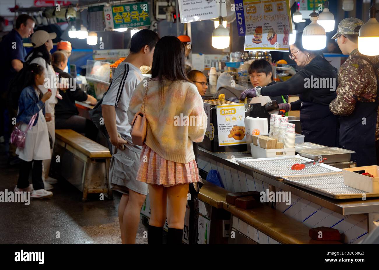SEOUL, SOUTH KOREA - OCTOBER 11, 2025 - Busy market hall with people at ...