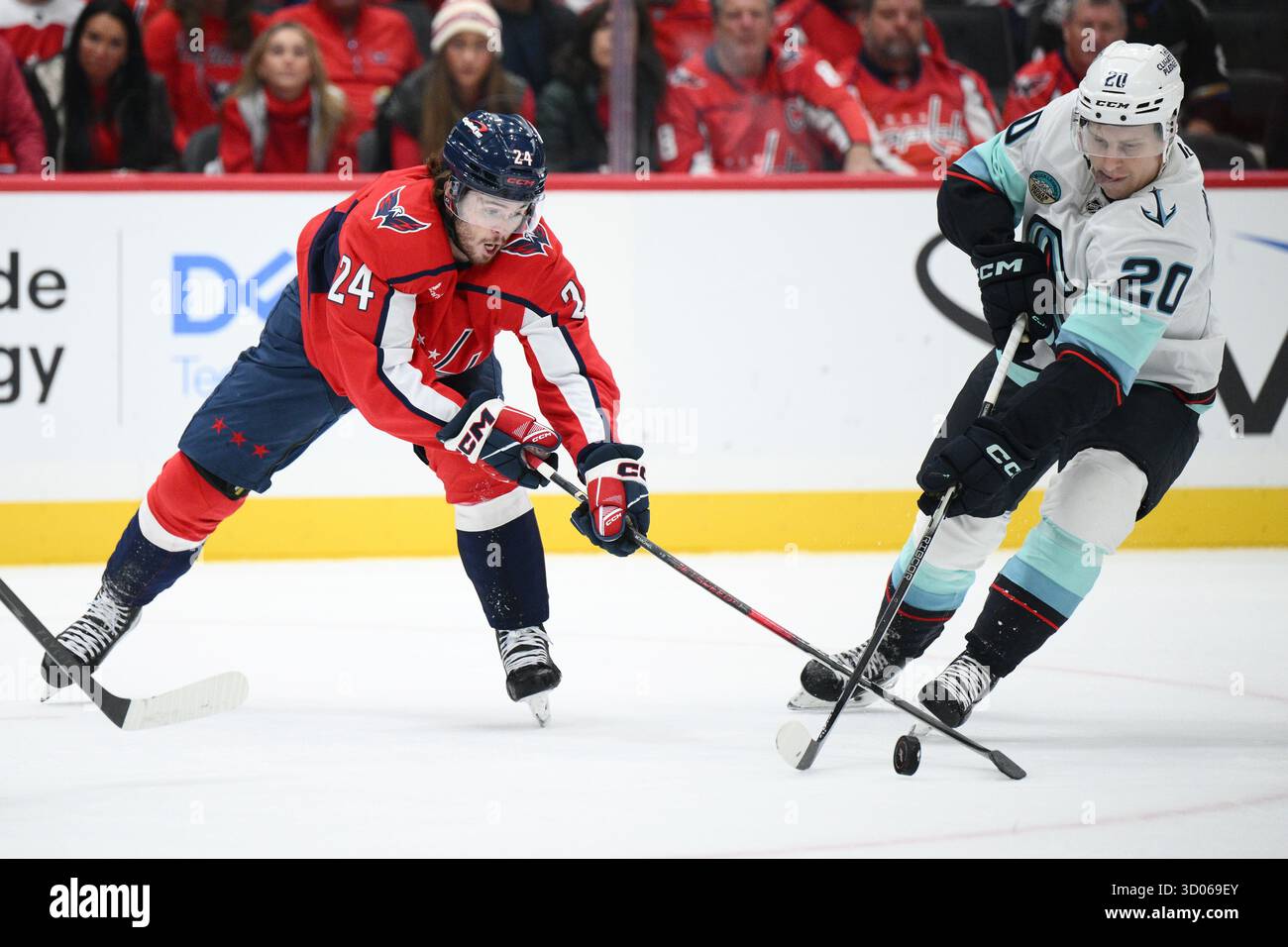 Washington Capitals center Connor McMichael (24) battles for the puck ...