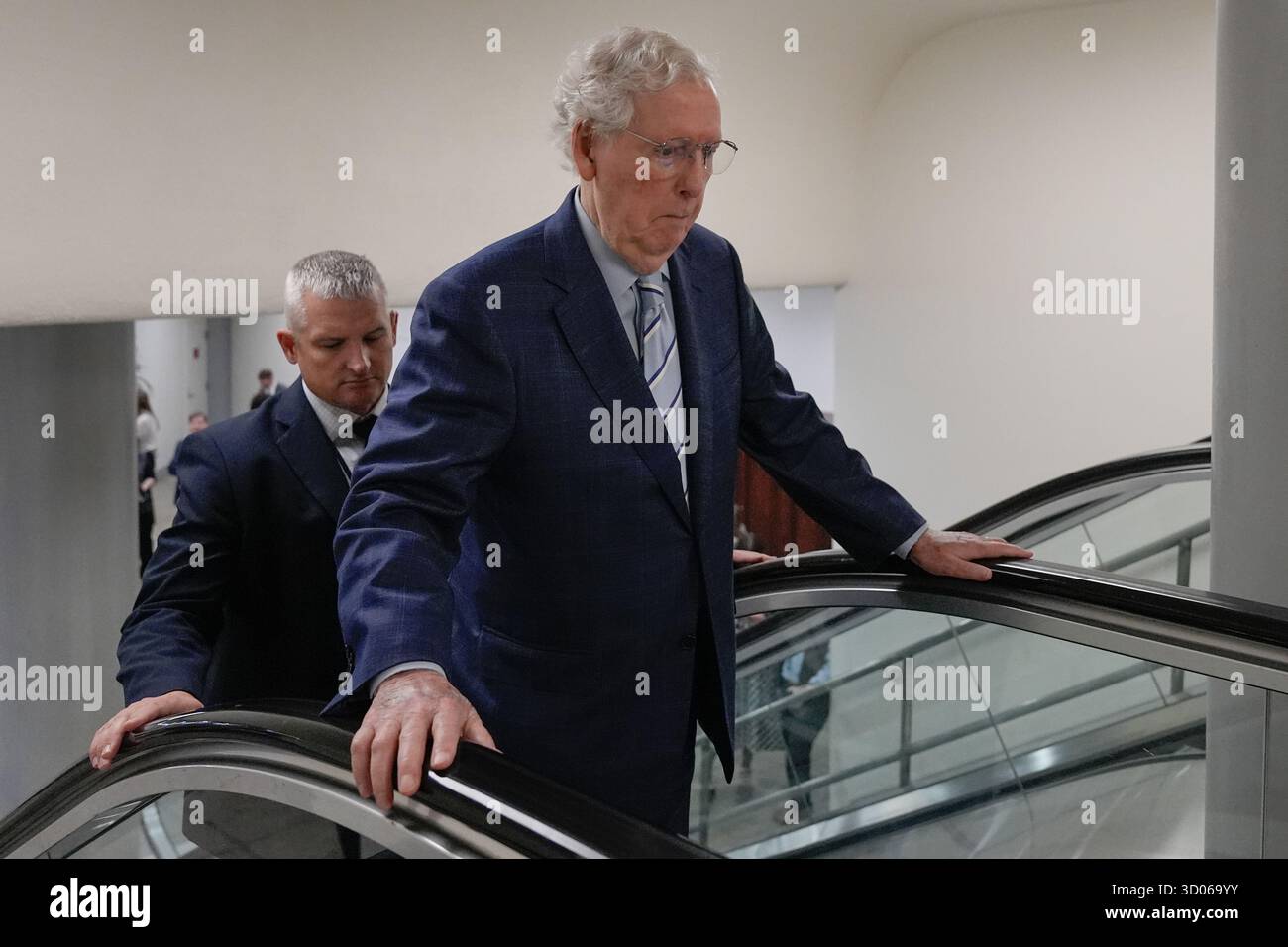 Sen. Mitch McConnell, R-Ky., right, arrives at the U.S. Capitol from ...
