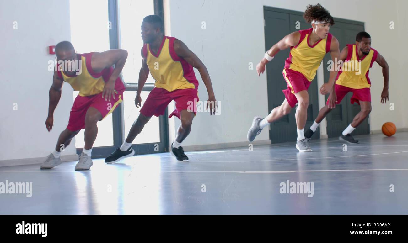 Performing defensive slide drill basketball players in yellow-red ...