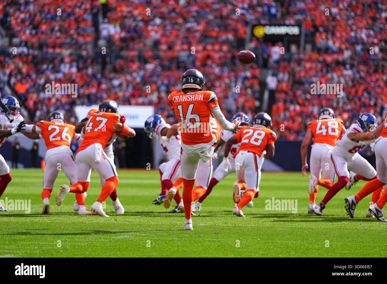 Denver Broncos punter Jeremy Crawshaw (16) punts against the New York ...