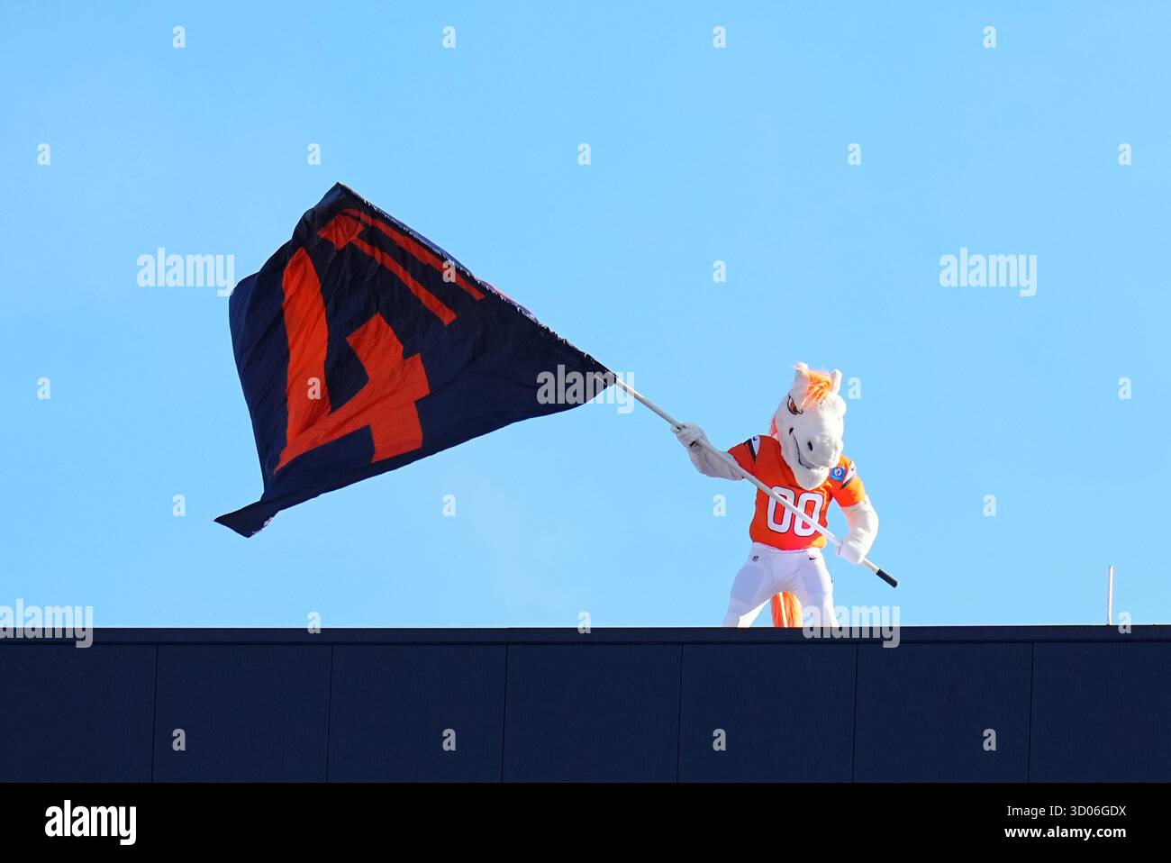 Miles, the Denver Broncos mascot, waves fourth quarter flag from atop ...