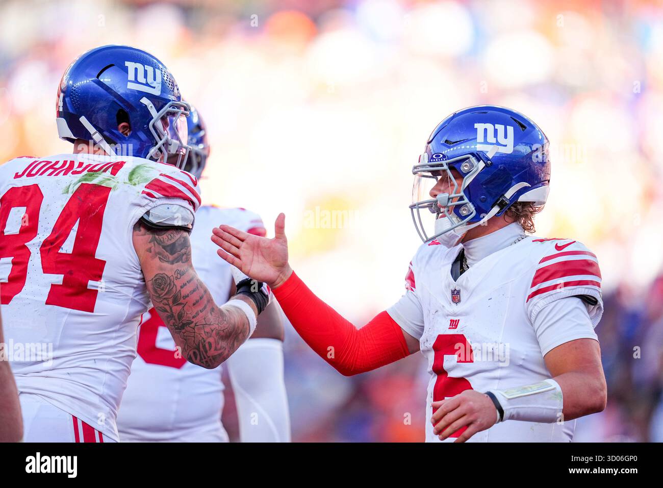 New York Giants tight end Theo Johnson celebrates a touchdown against ...