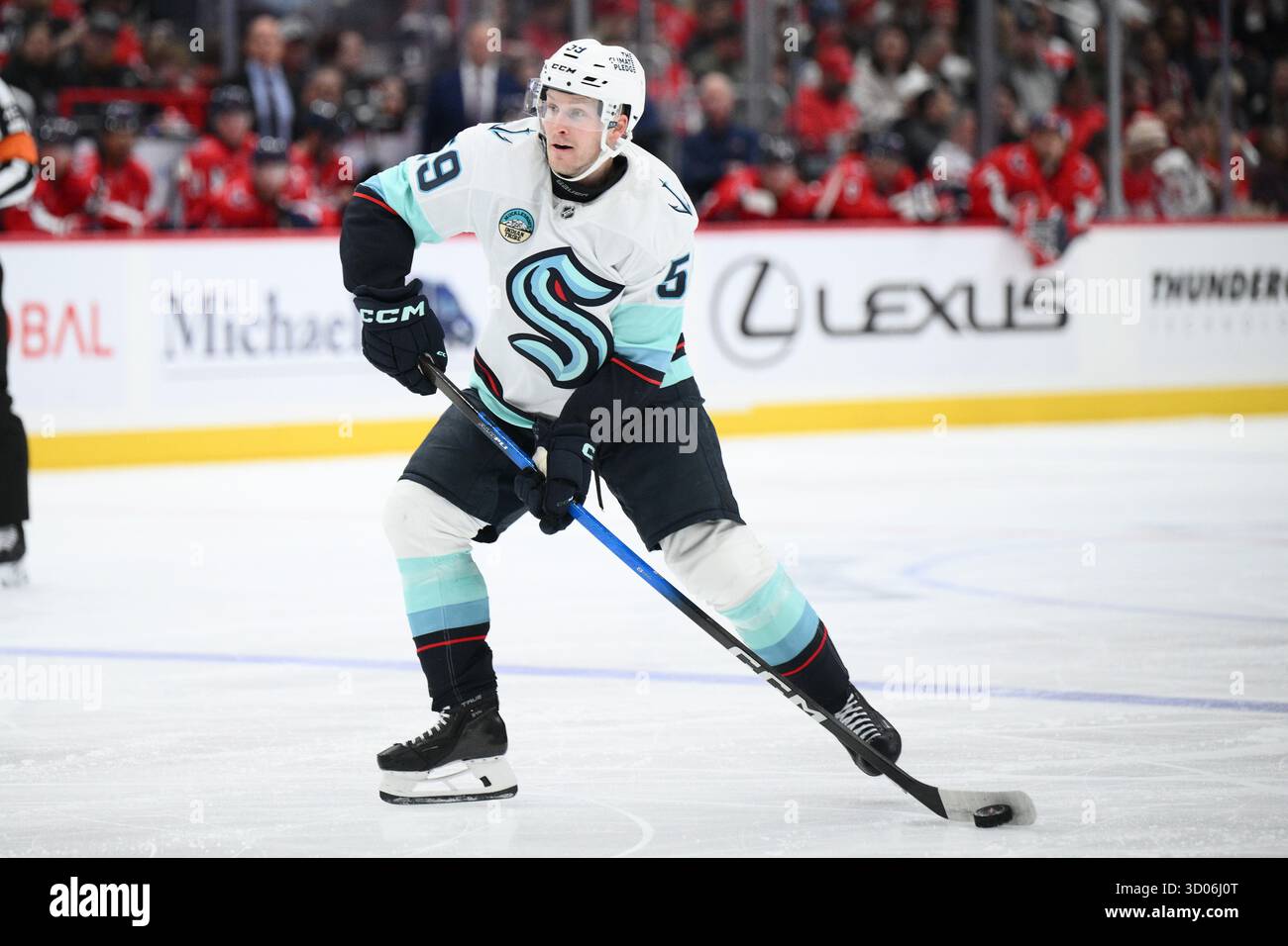 Seattle Kraken center Ben Meyers (59) skates with the puck during the ...
