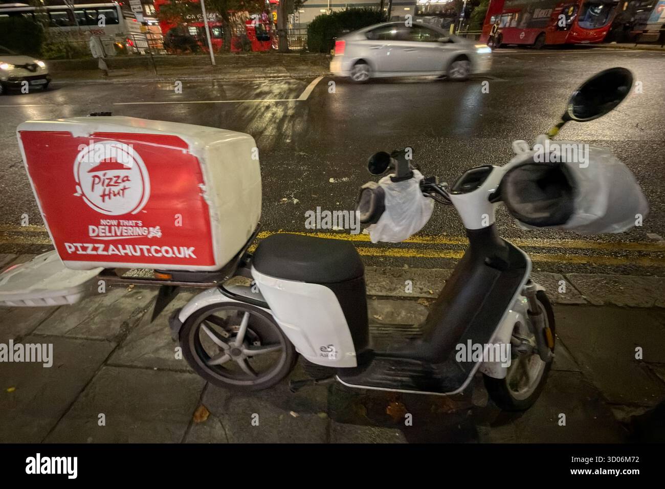 Outlook of a Pizza Hut delivery bike located outside of branch that brought by Yum! brands via ...