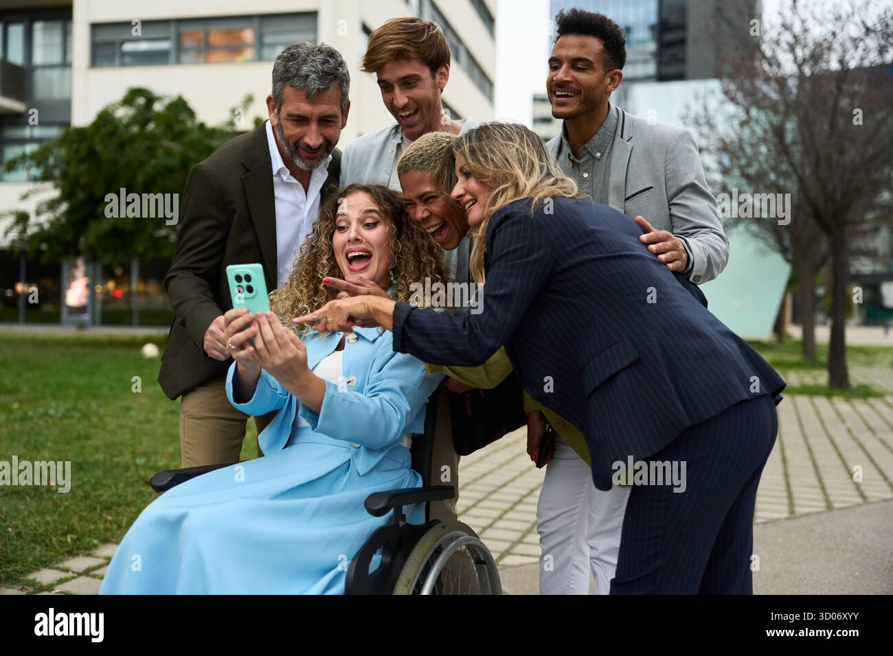Diverse business team sharing happy moments on phone Stock Photo - Alamy