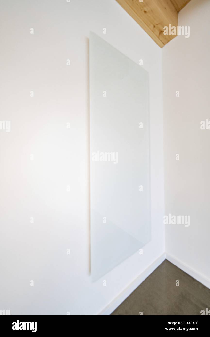 Large white glass wall panel in a bright room with wooden beam ceiling ...