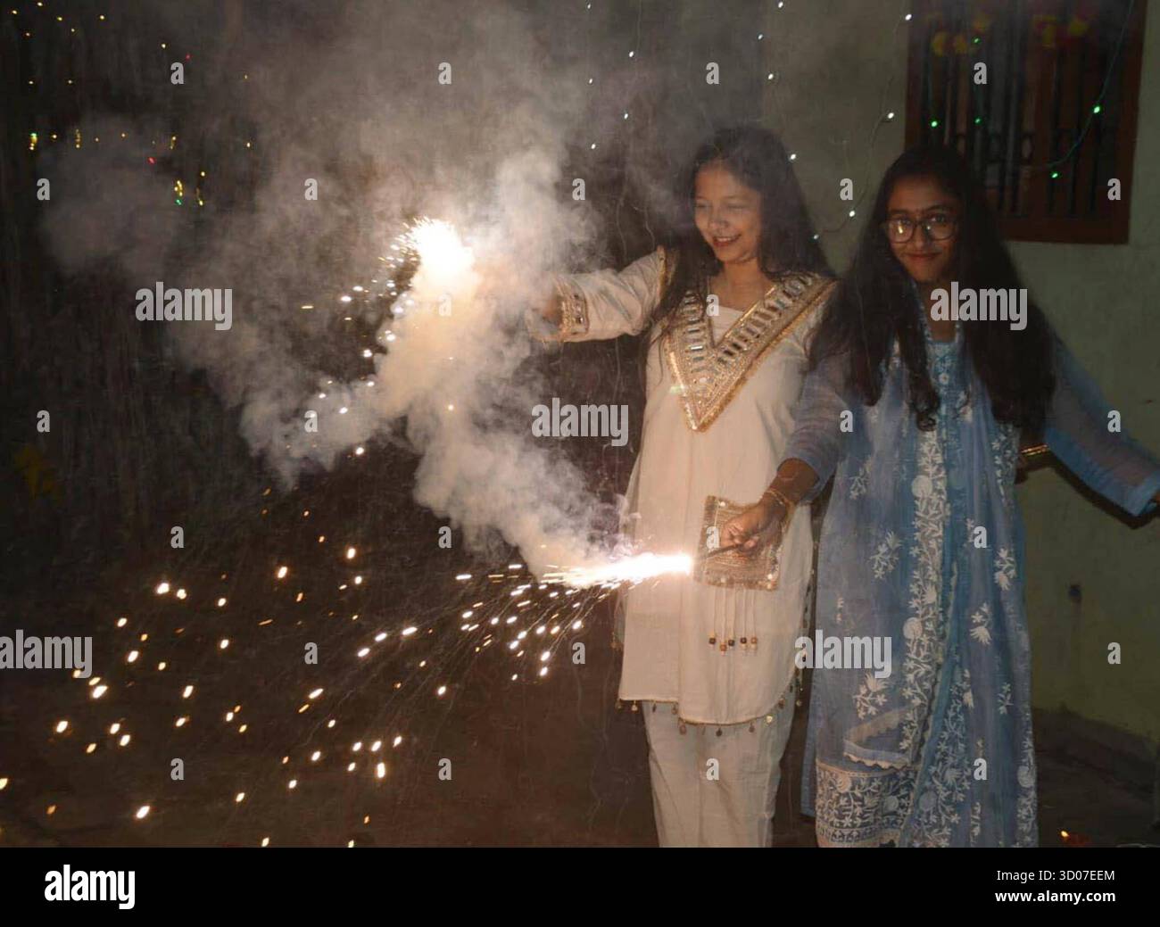 PATNA, INDIA - OCTOBER 20: Girls firing crackers on the occasion of ...