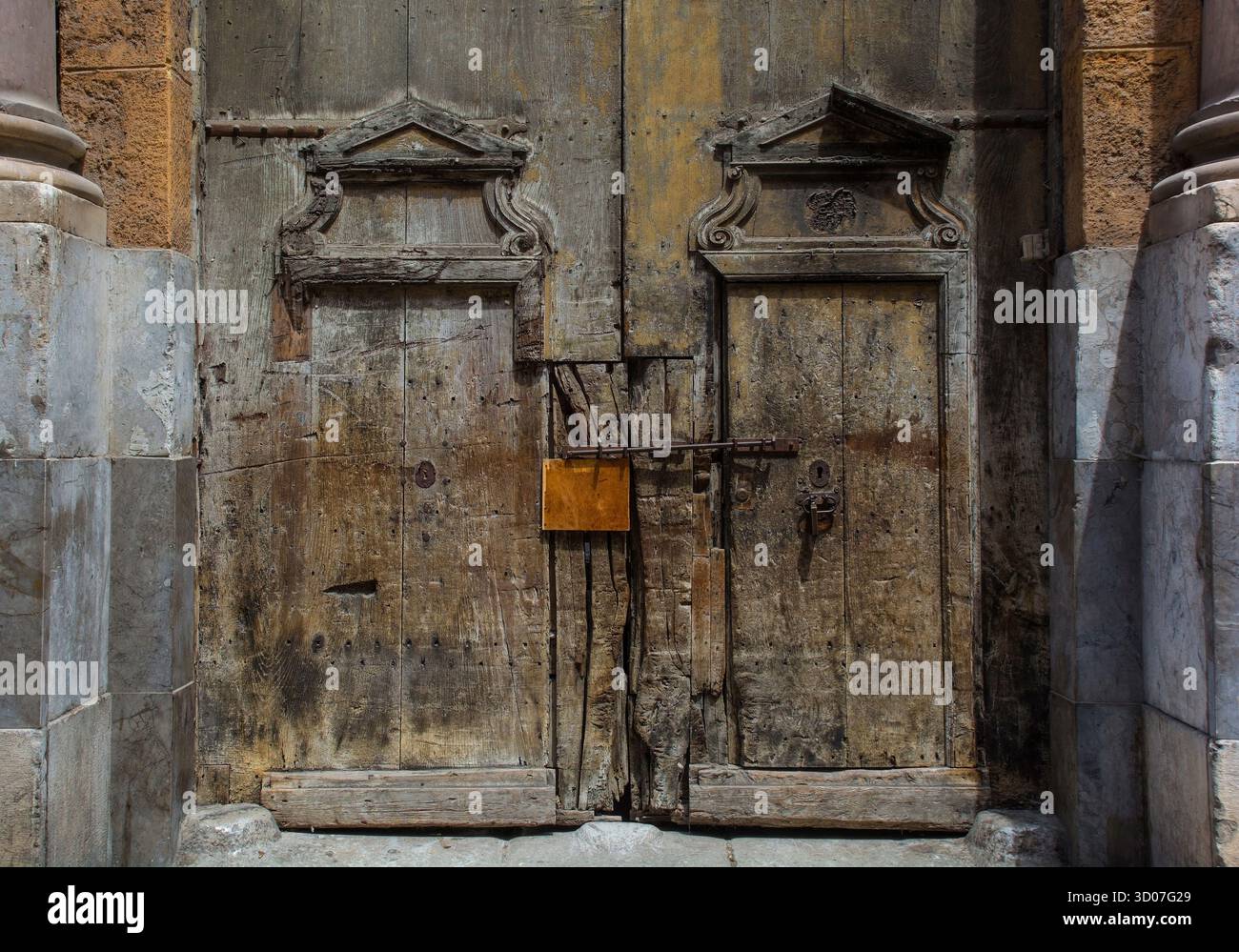 Two weathered wooden wicket doors in a derelict building in Palermo ...