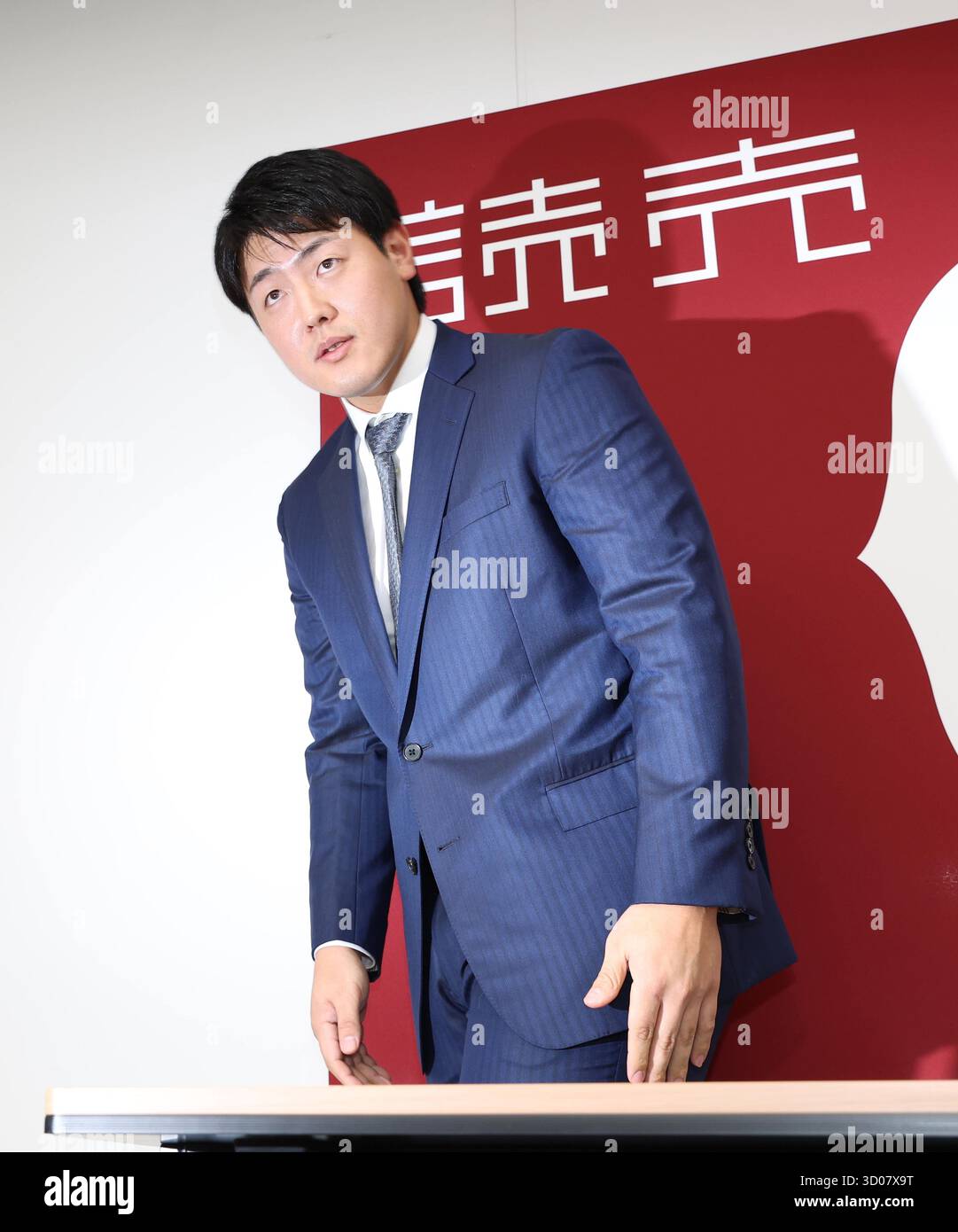 Yomiuri Giants infielder Kazuma Okamoto attends a press conference in Chiyoda Ward, Tokyo, on ...