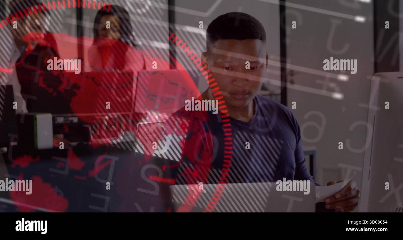 Reviewing African American man examining computer data while reading ...