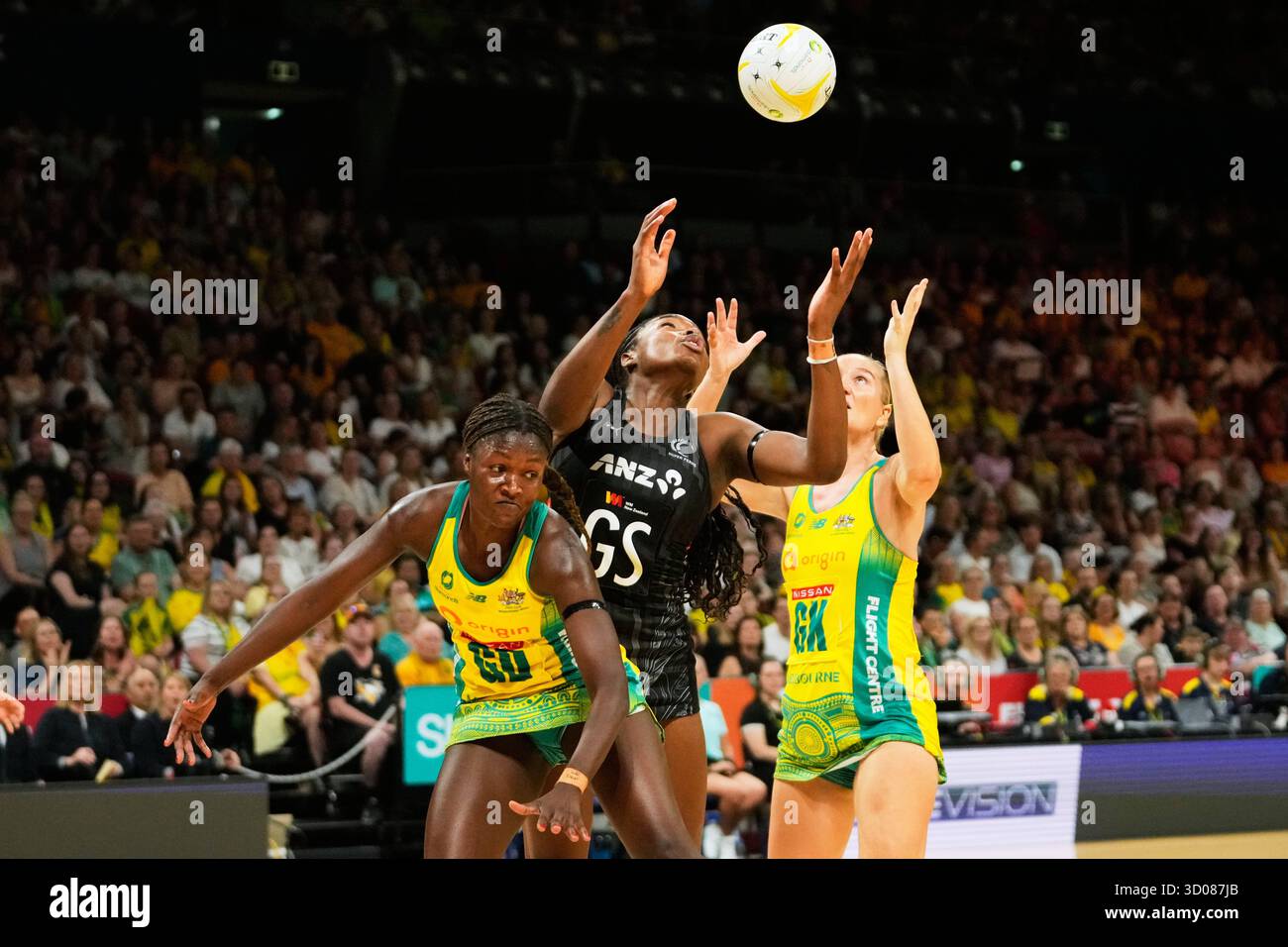 New Zealand's Grace Nweke, centre, competes for the ball with Australia ...