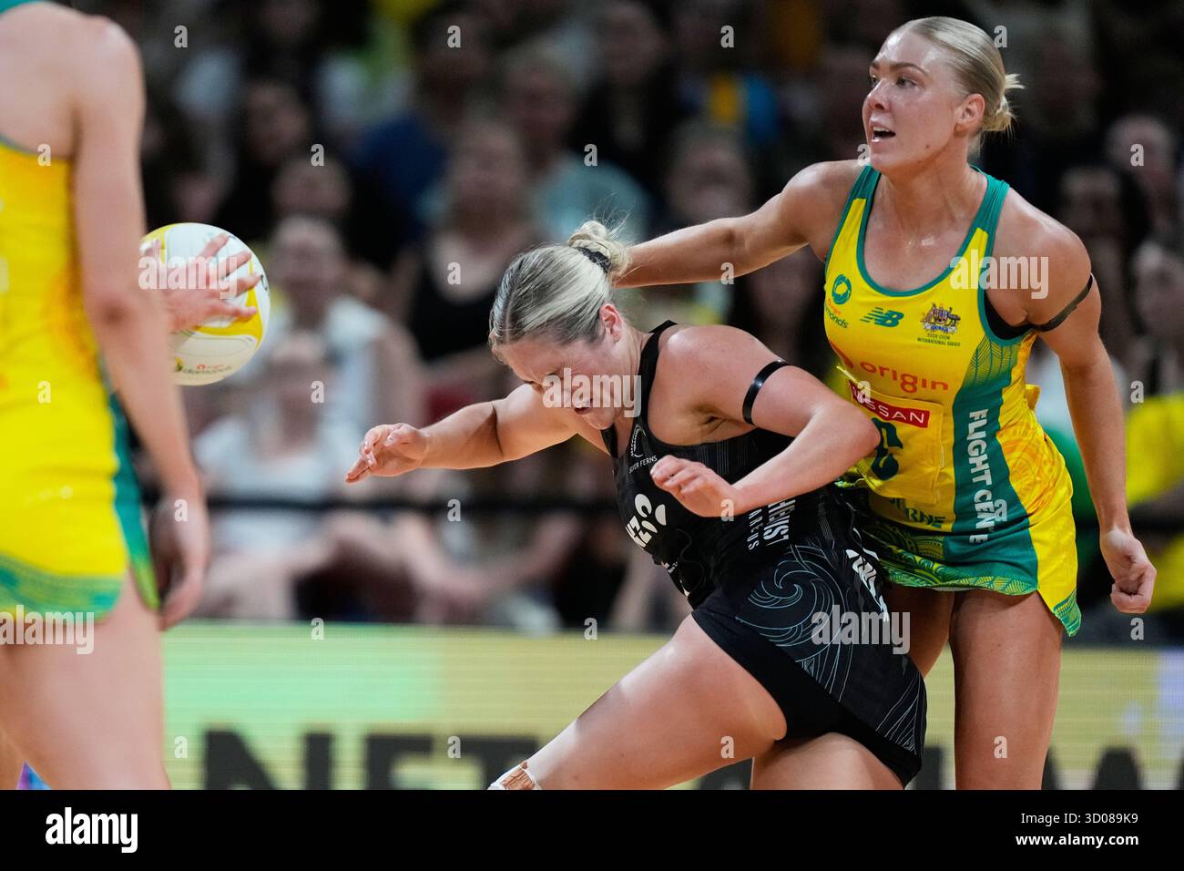 New Zealand's Maddy Gordon and Australia's Kate Moloney, right, compete ...