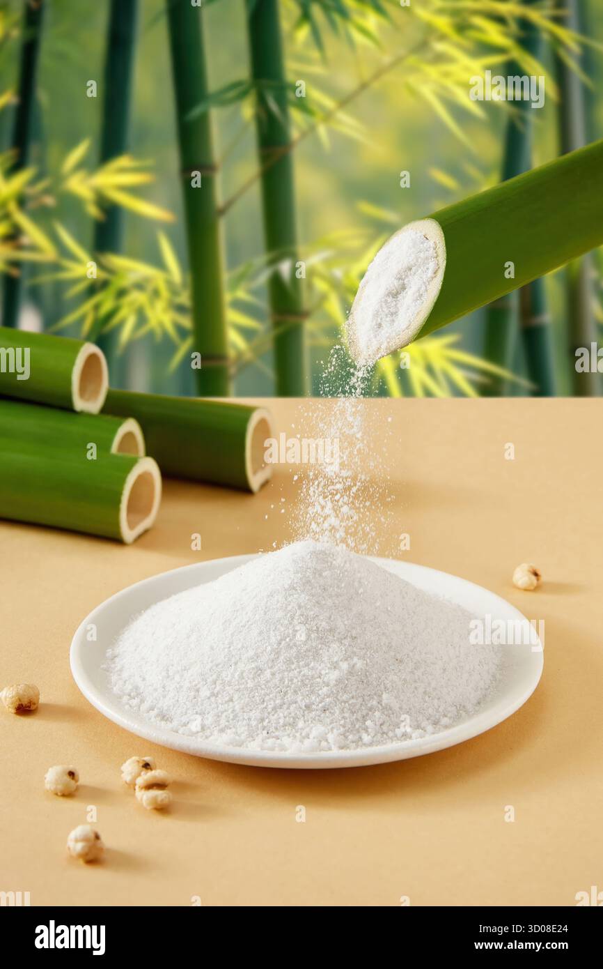 White bamboo powder falling from bamboo stem onto plate, concept of ...